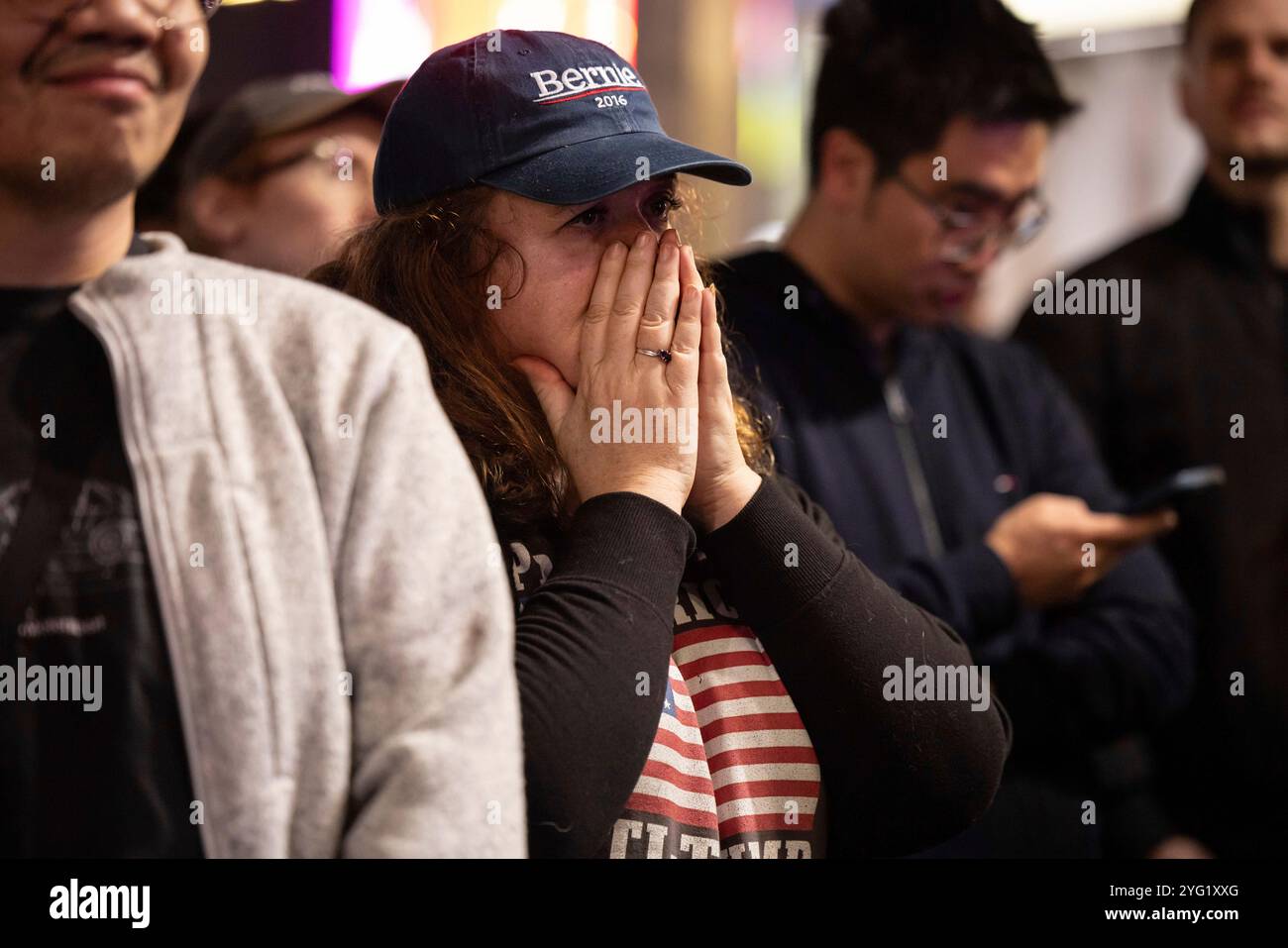 A person reacts while watching an ABC News livestream showing poll ...