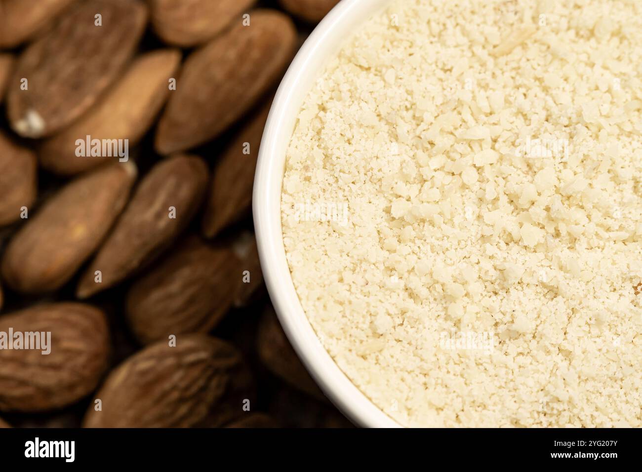 raw almond nuts and almound flour close up Stock Photo - Alamy