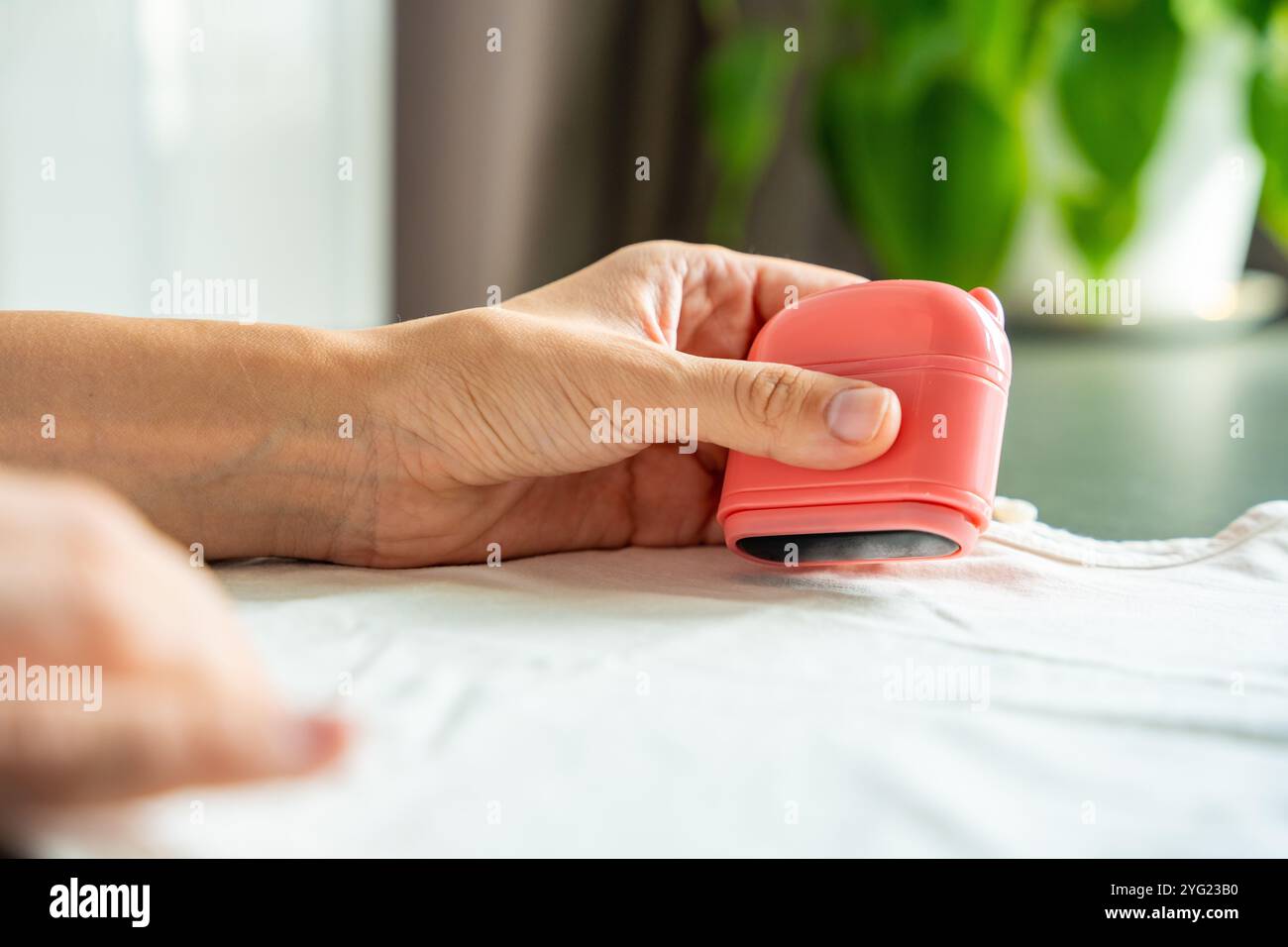 Close-up view of woman's hands with a stamp with a name for signing ...