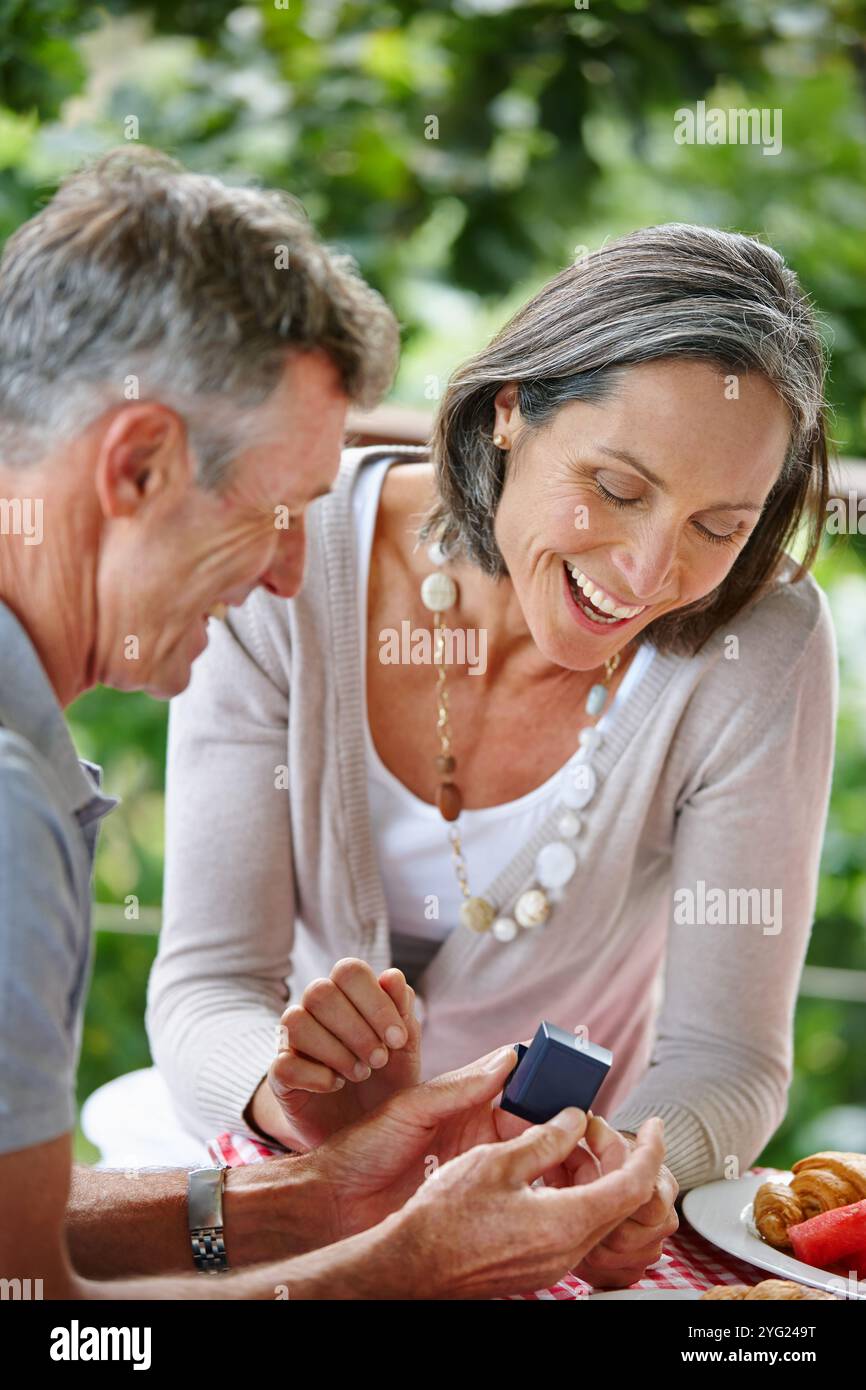 Senior couple, ring and marriage proposal outdoor for relationship ...