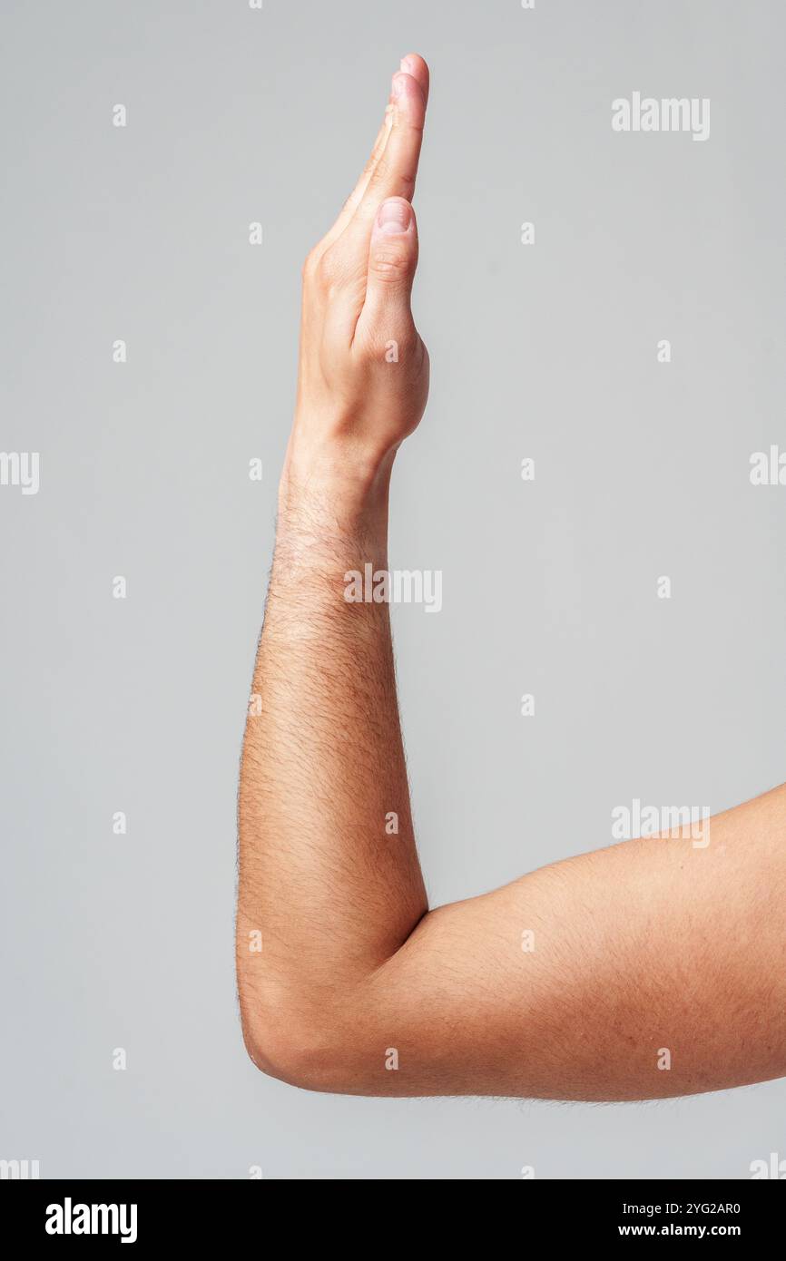 A person hand gesture against a neutral background Stock Photo - Alamy