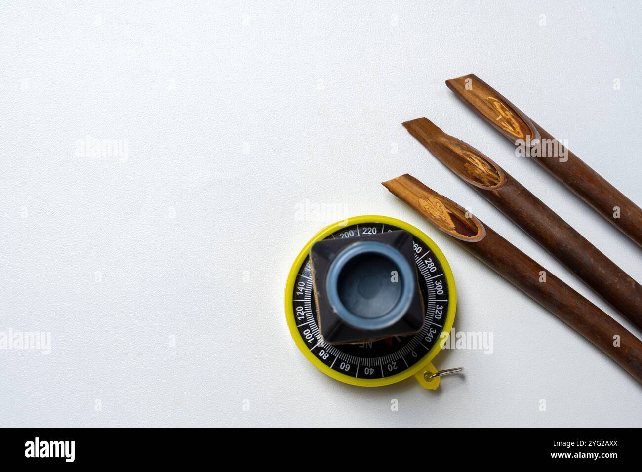 Set of calligraphy reeds and qibla compass isolated over white ...
