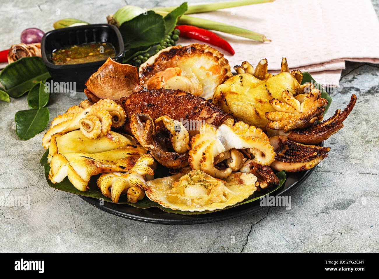 Asian grilled seafood mix plate - squid, cuttlefish, scallops and ...