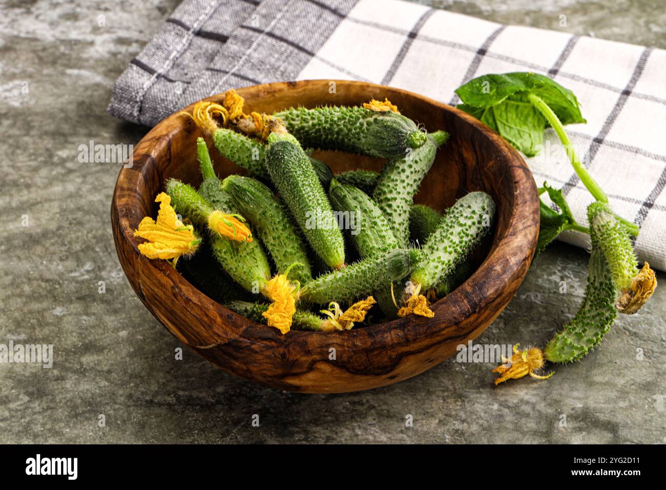 Raw gherkin cucumbers in the bowl served leaf Stock Photo - Alamy