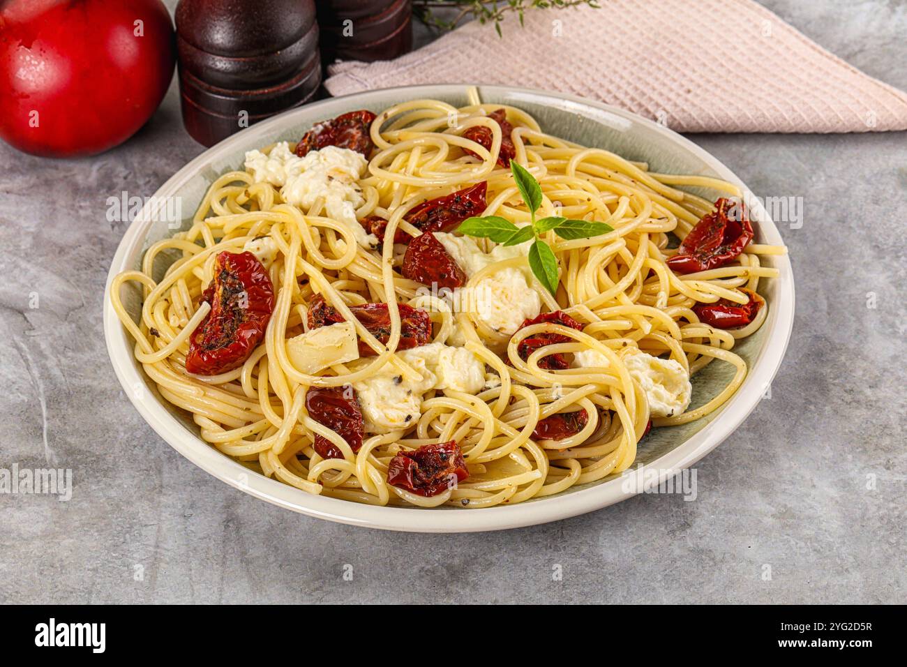 Italian pasta spaghetti with stracciatella and tomato Stock Photo - Alamy