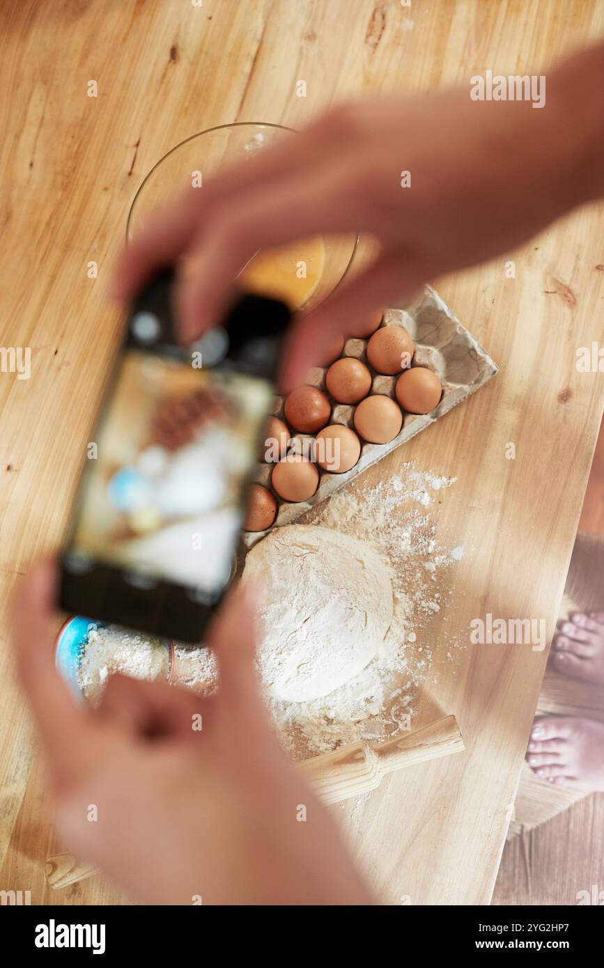 Baking, phone and photograph with hands of influencer person in kitchen ...