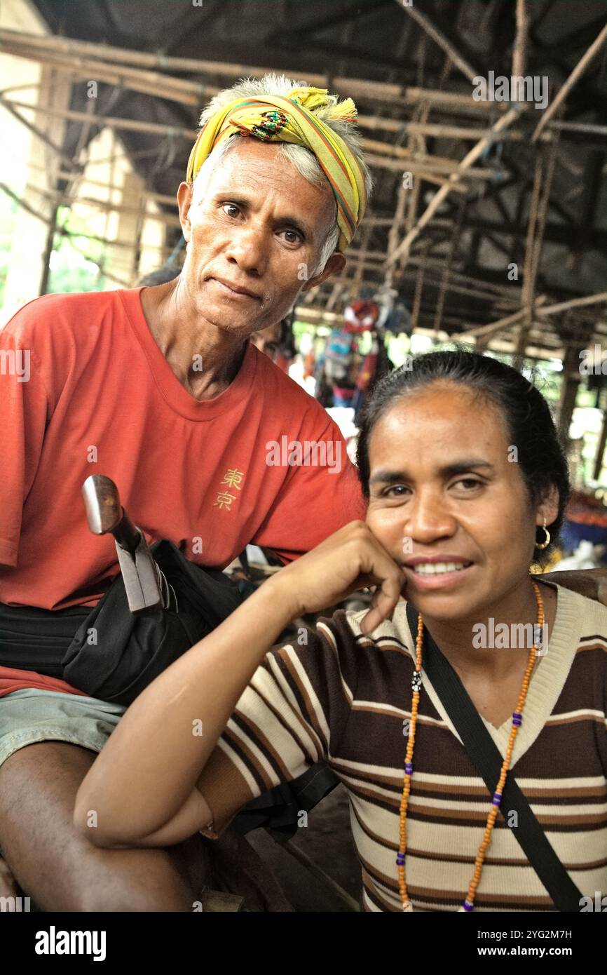 Portrait of a couple who are selling spices and betel chewing sets at a ...