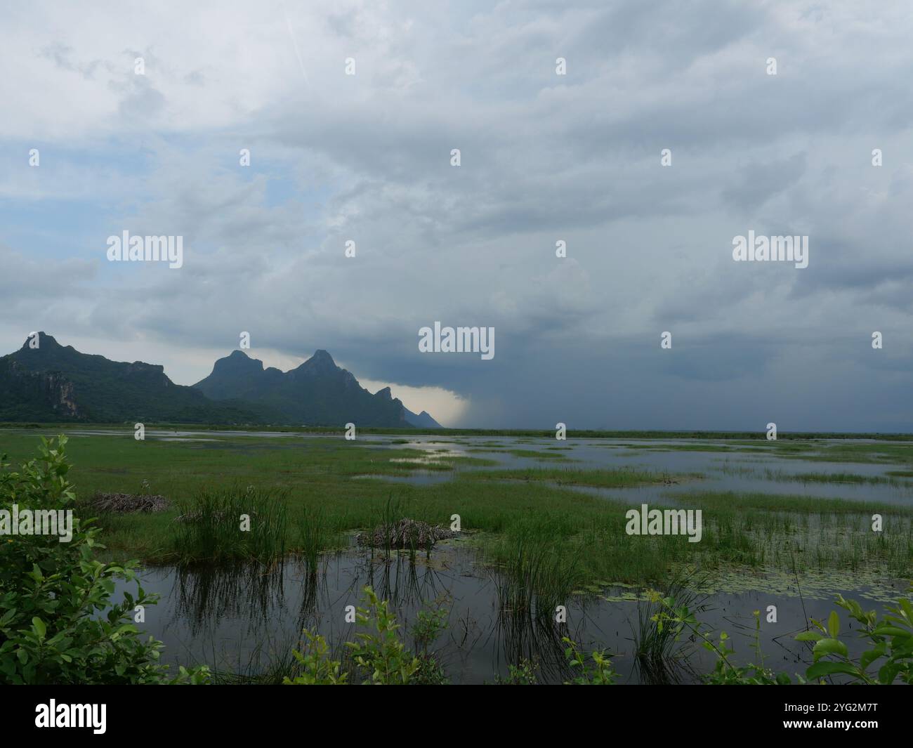 Gray Cumulonimbus cloud formations on sky above mountain, Nimbus moving ...