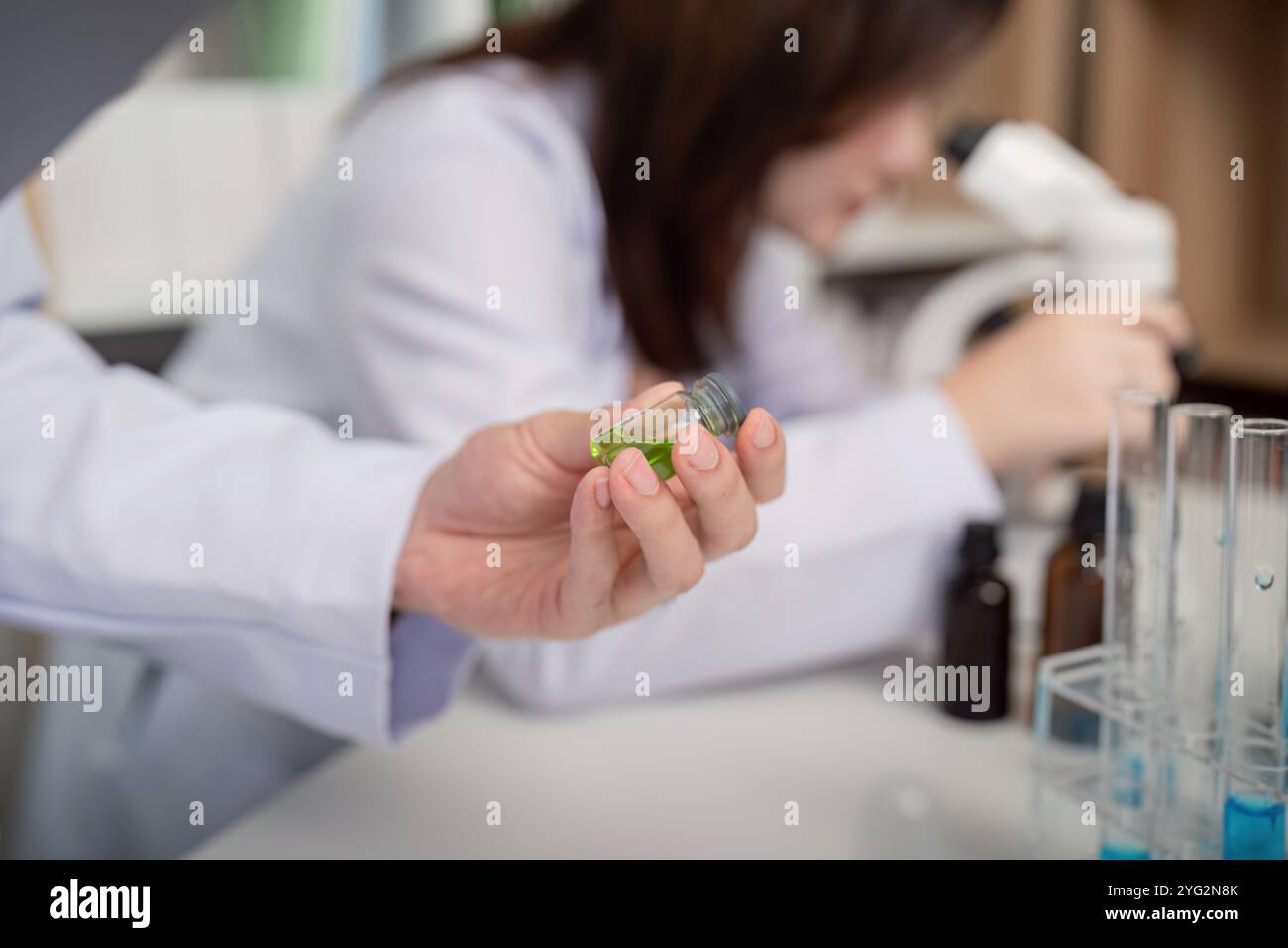 Researcher Analyzing Specimen Under Microscope in Science Lab Stock ...