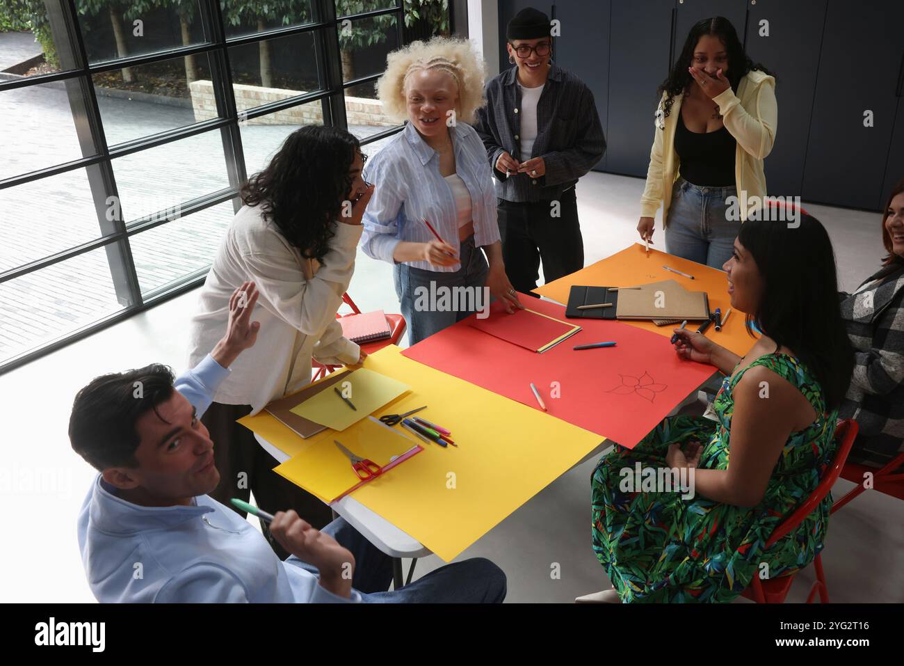 People working on creative project together Stock Photo - Alamy