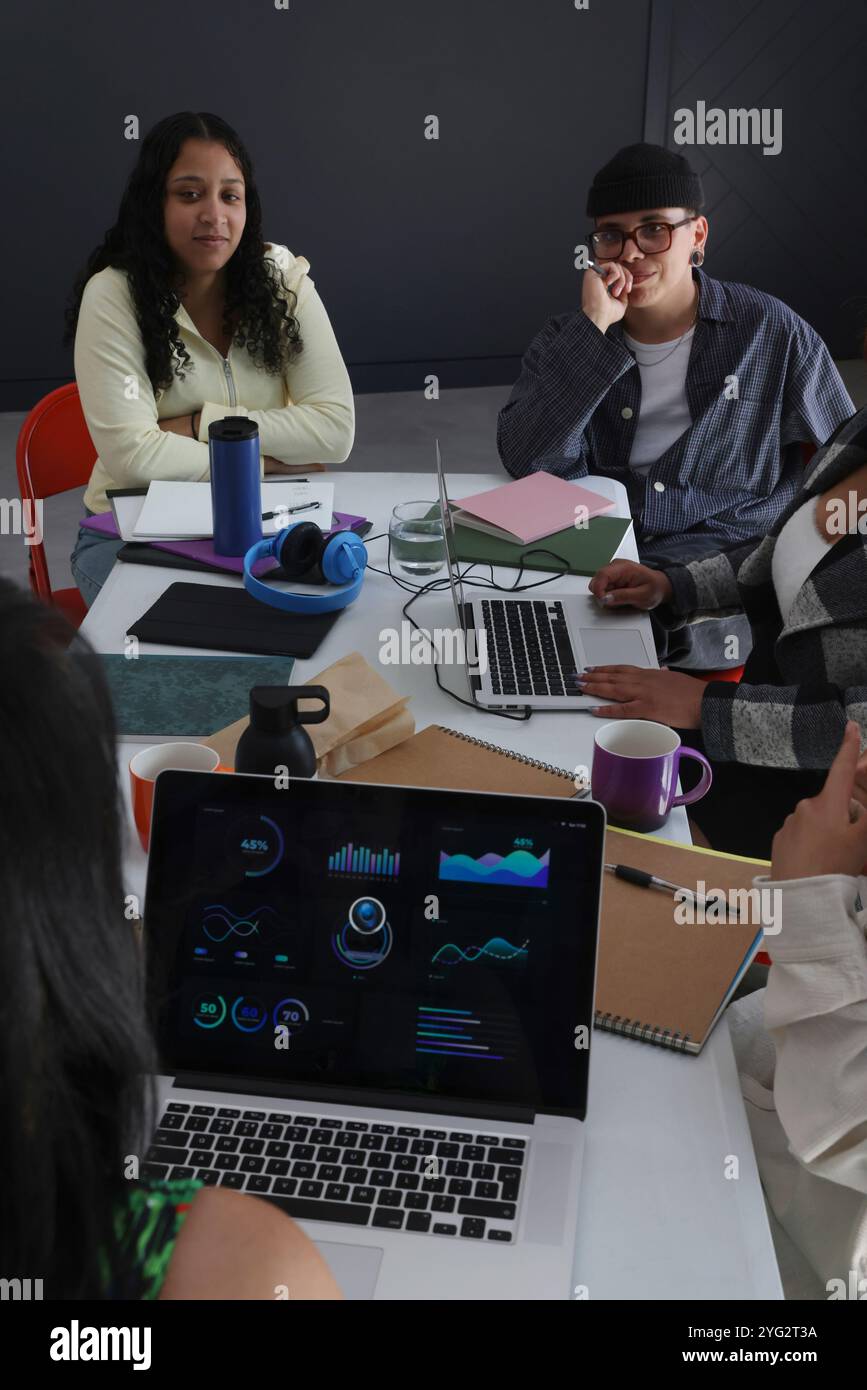 People sitting at table during meeting Stock Photo - Alamy