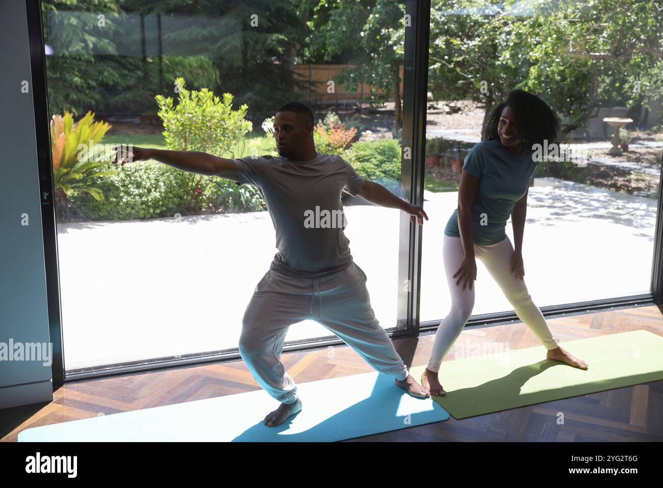 Woman and man with Down syndrome practice yoga Stock Photo - Alamy