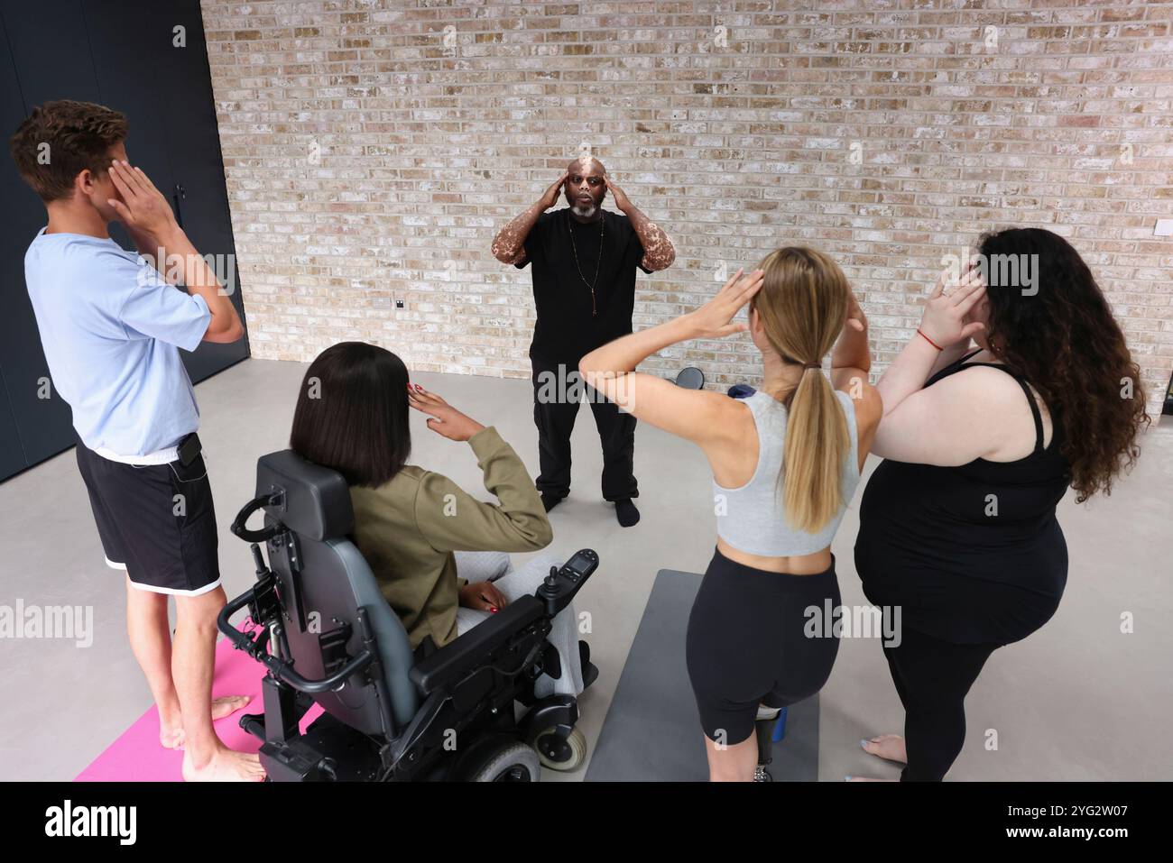 People doing relaxation exercise in gym together Stock Photo - Alamy