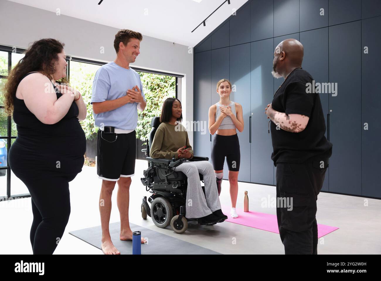 People doing relaxation exercise in gym together Stock Photo - Alamy
