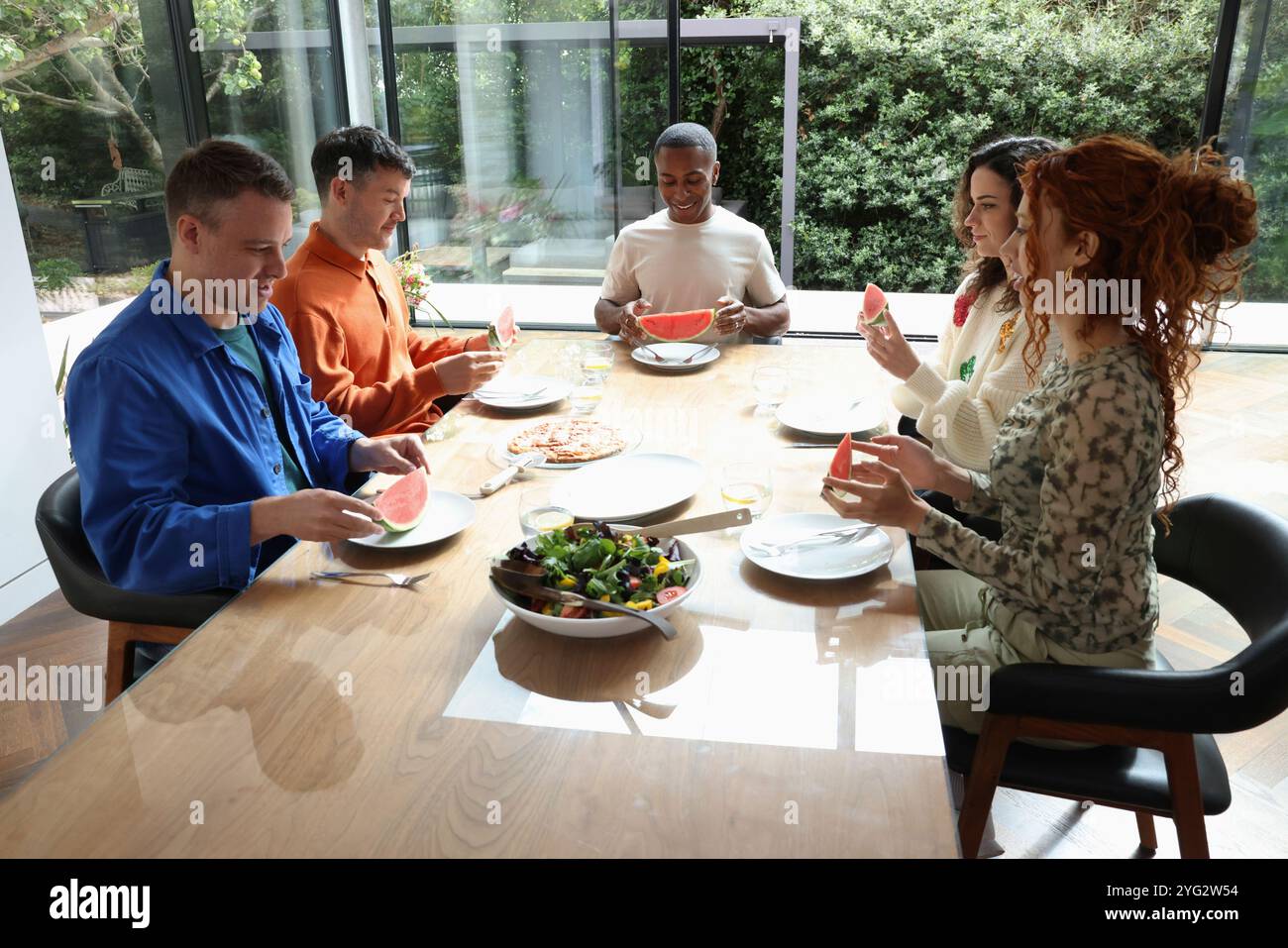 Friends having lunch together Stock Photo - Alamy