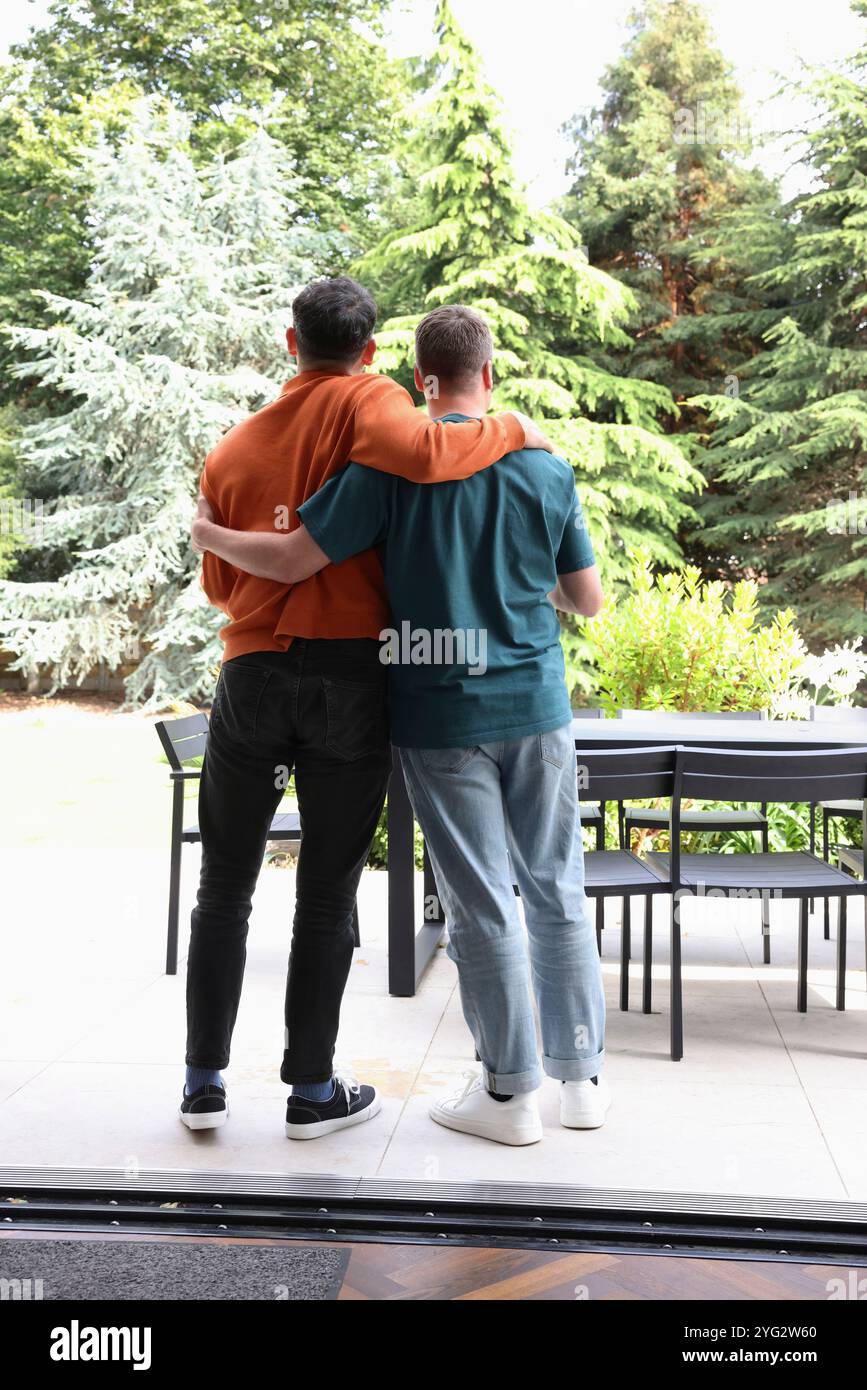 Men relaxing on patio Stock Photo - Alamy
