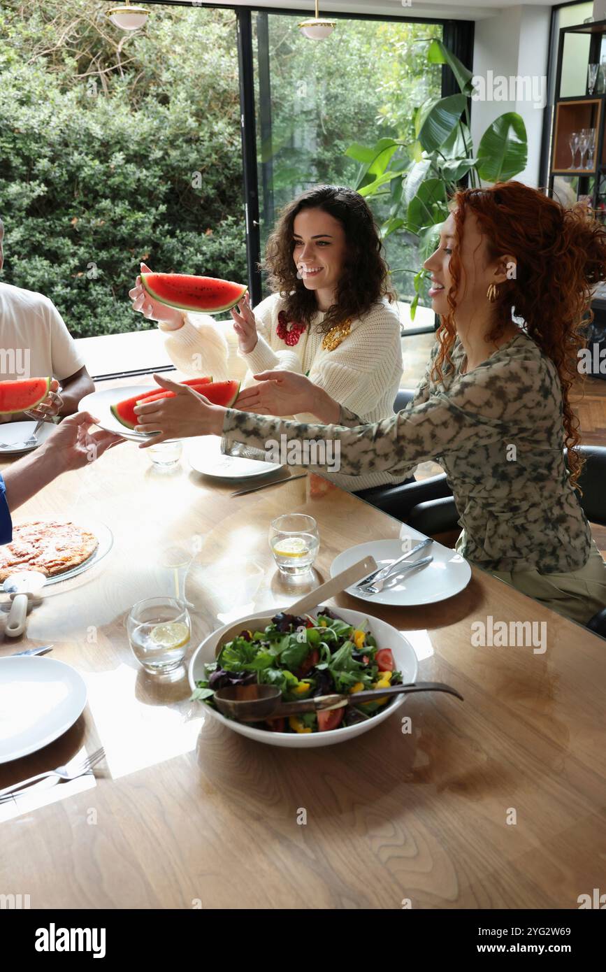Friends having lunch together Stock Photo - Alamy