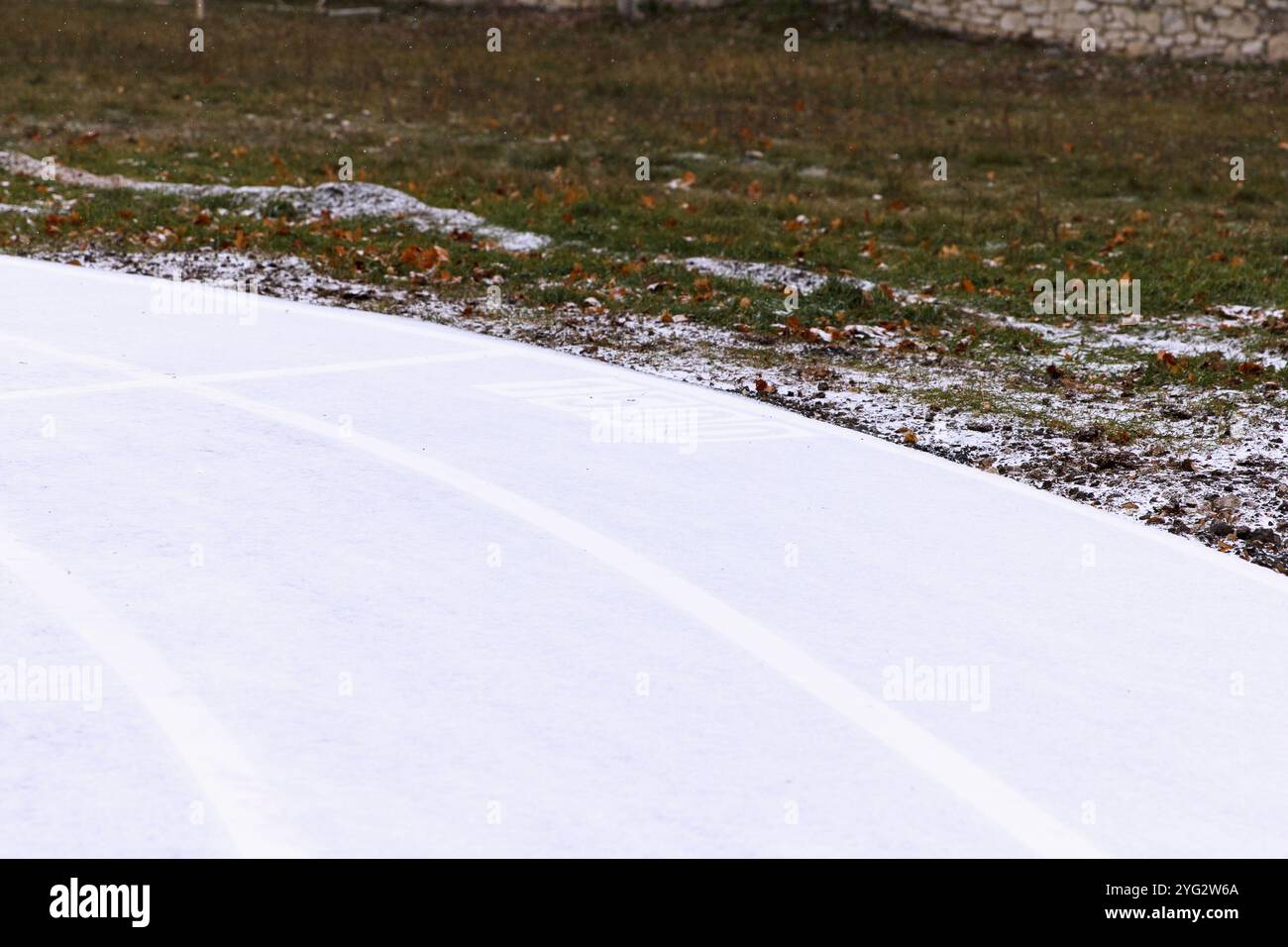New treadmill, paved, with markings for runner athletes. In winter in ...