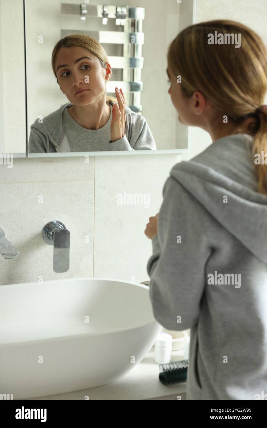 Mirror reflection woman applying hi-res stock photography and images ...