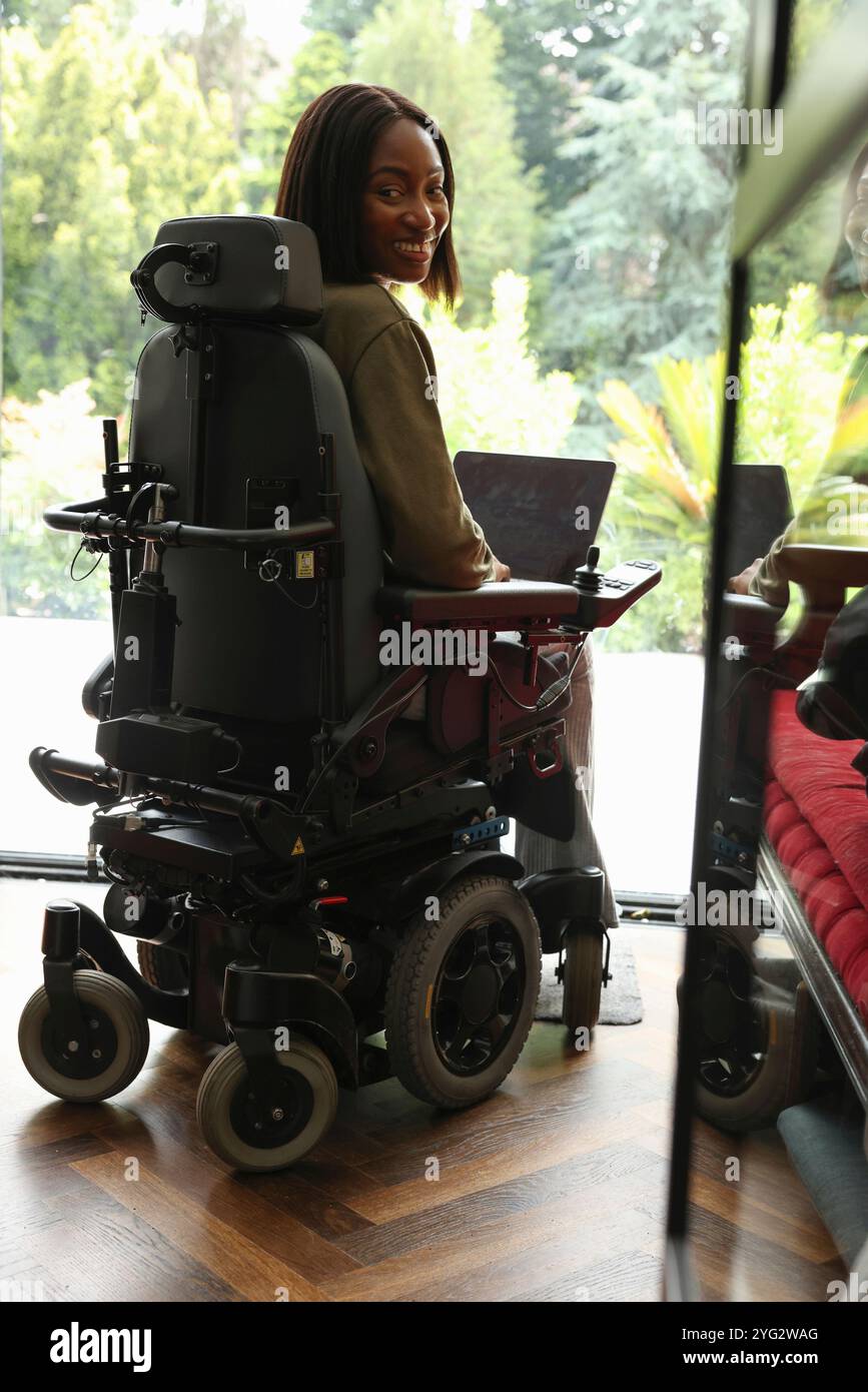 Black woman in wheelchair using hi-res stock photography and images - Alamy