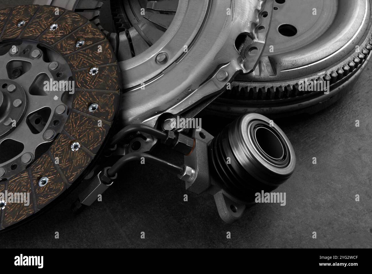 Car engine clutch on black stone surface Stock Photo - Alamy