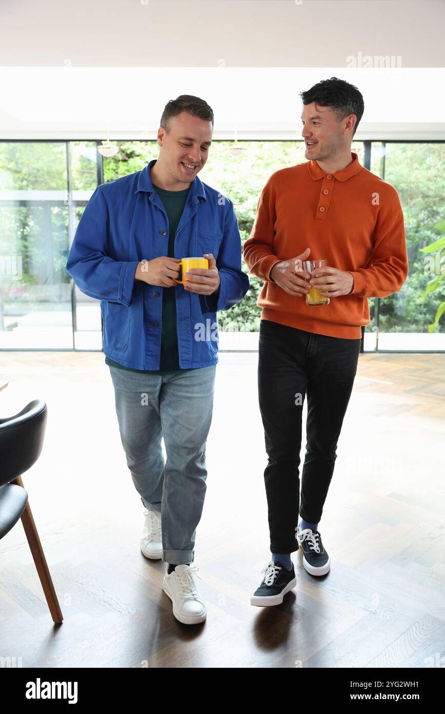 Two men walking side by side hi-res stock photography and images - Alamy