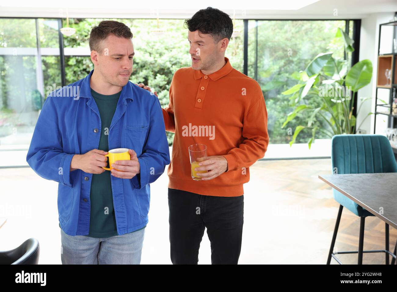 Two men holding glass hi-res stock photography and images - Alamy