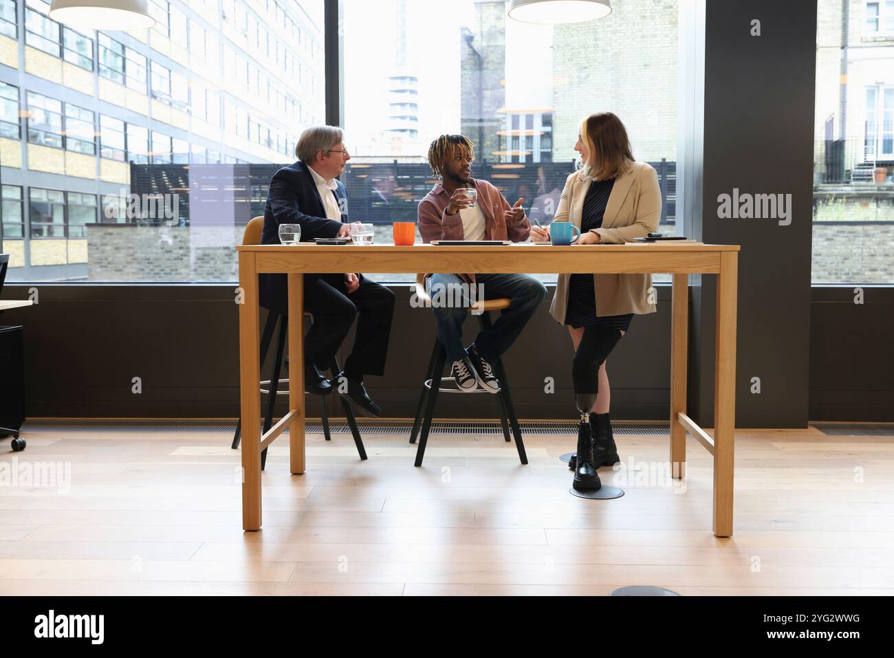 Four multiracial business people in hi-res stock photography and images ...