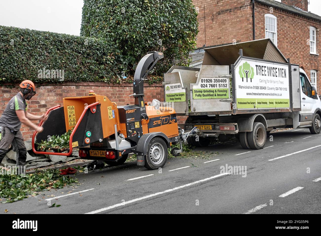 Tree trimming and hedge trimming workman and Forst ST6 wood chipper ...