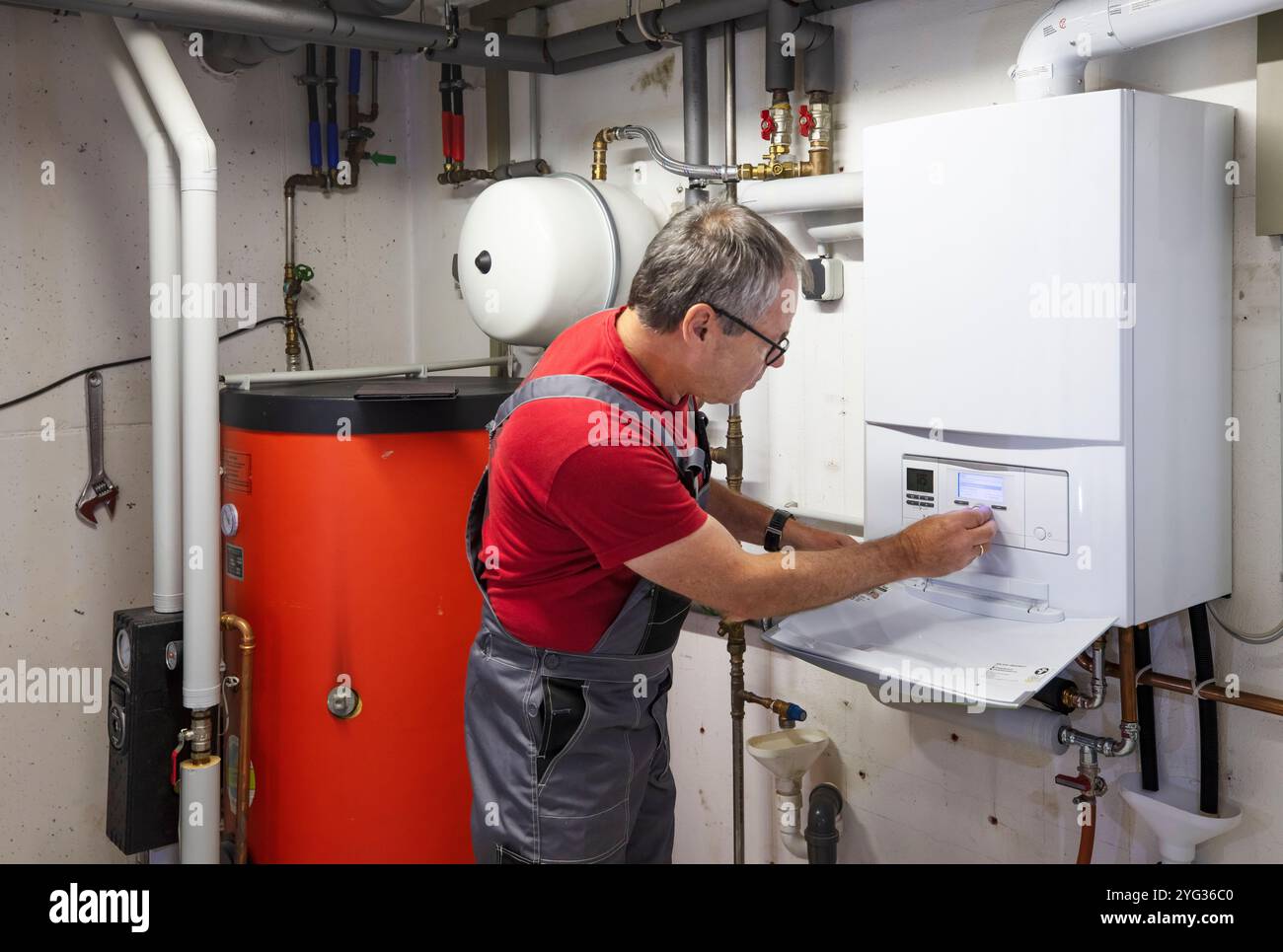 installer checks a modern gas heating Stock Photo - Alamy
