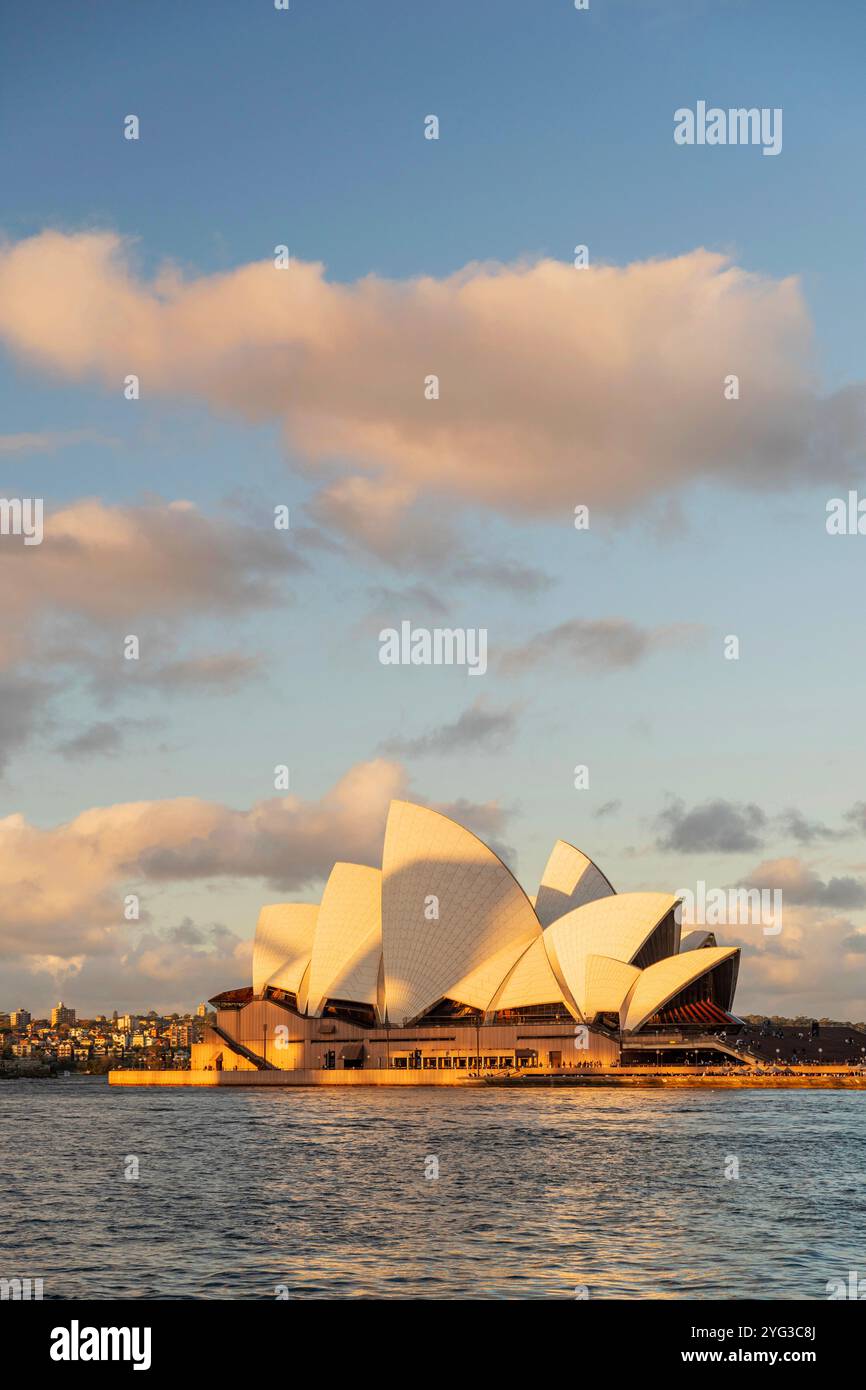 Distinctive building of Sydney Opera House in sunset light. It is the ...