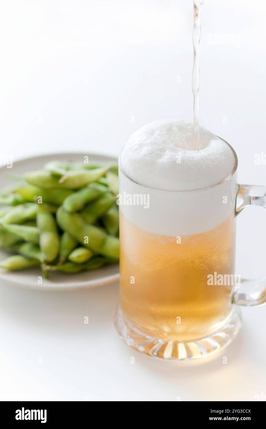 Jokkis of beer and edamame Stock Photo - Alamy