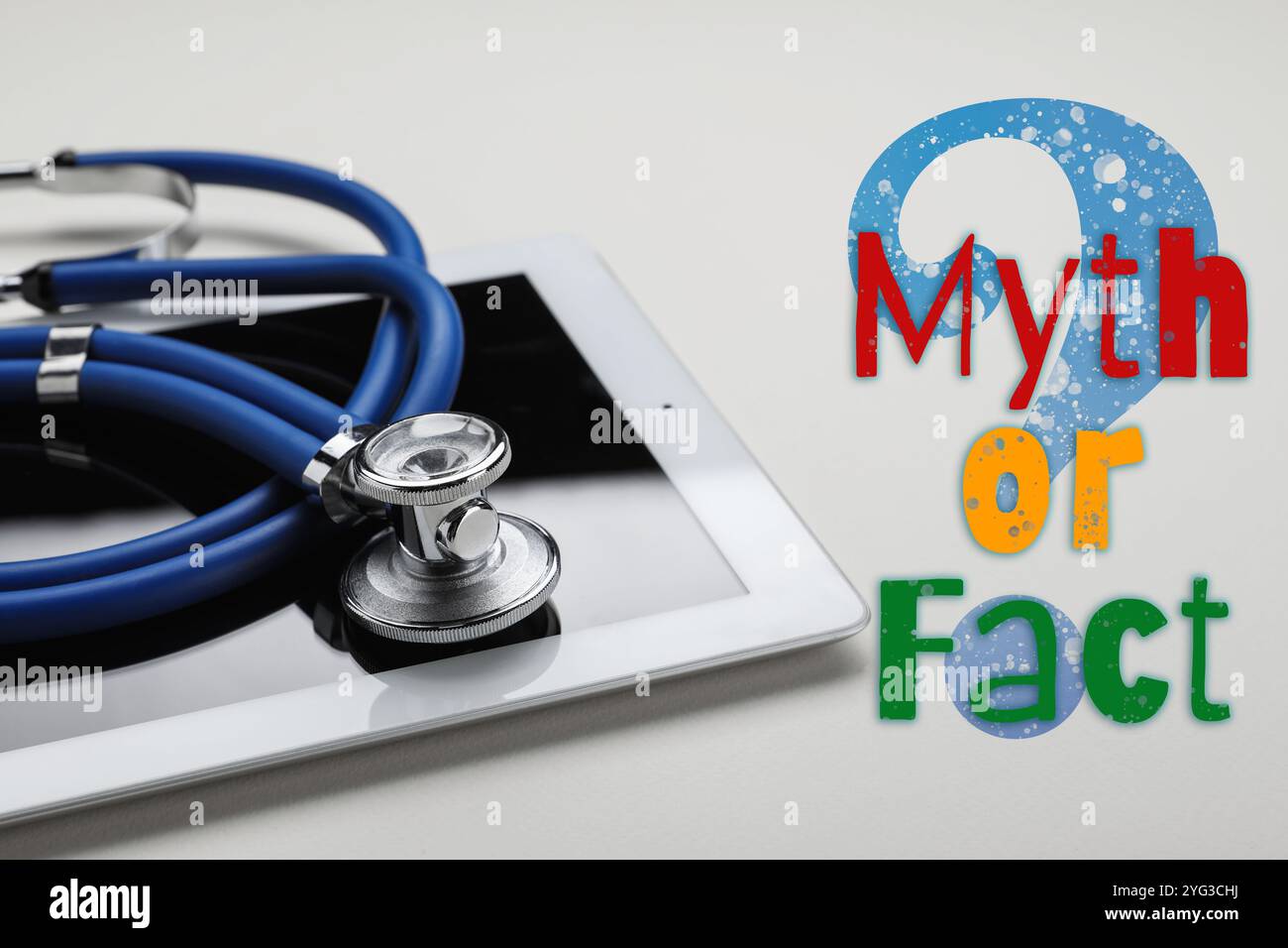 Medical myths. Tablet and stethoscope near question mark with words on ...
