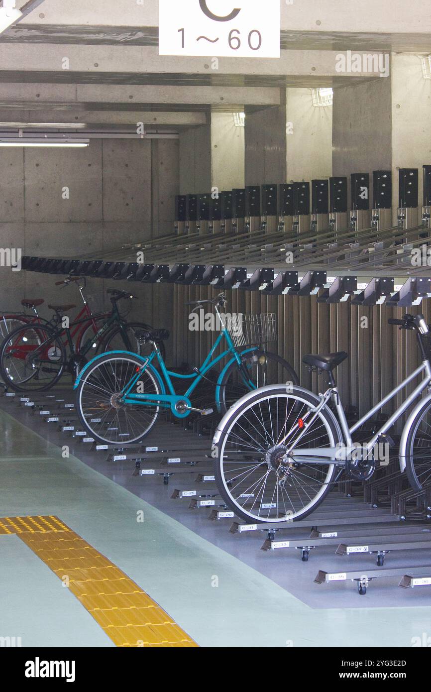 Indoor pay bicycle parking Stock Photo - Alamy