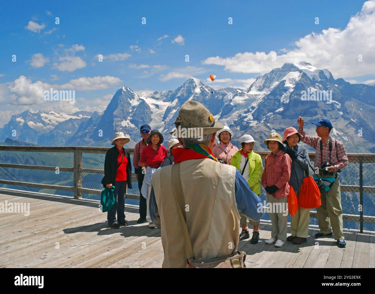 Man taking picture of Japanese tourists on viewing deck at Birg station ...
