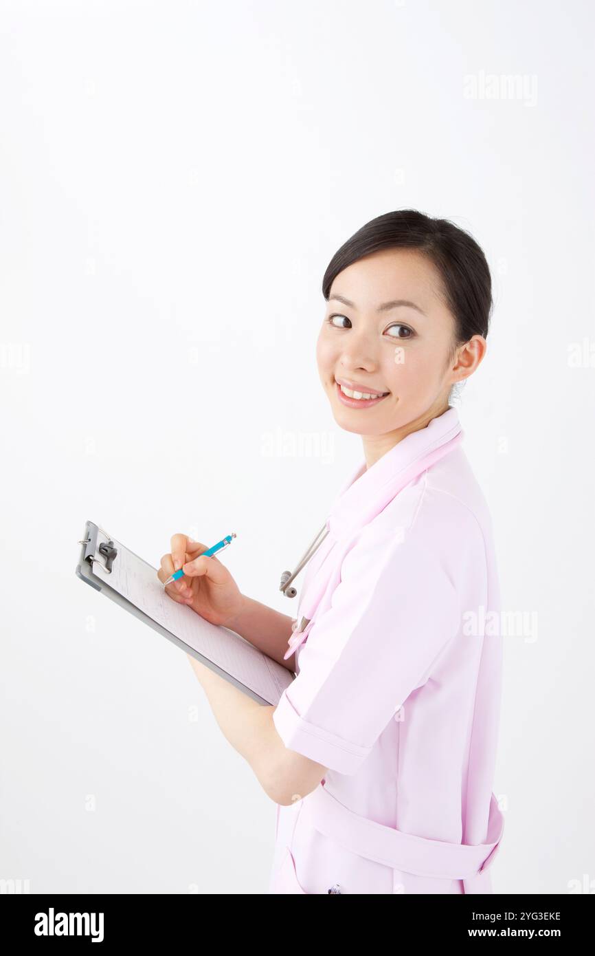 Pink nurse uniform hi-res stock photography and images - Alamy
