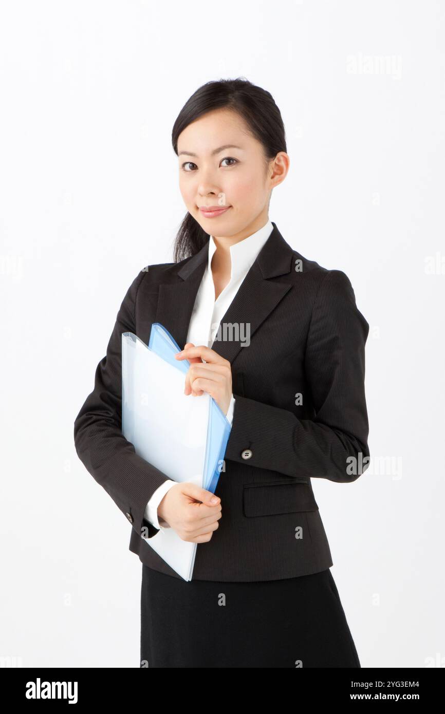 Office worker holding file Stock Photo - Alamy