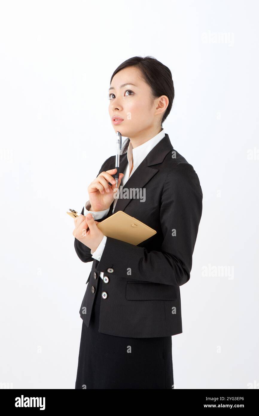 Office worker checking schedule Stock Photo - Alamy
