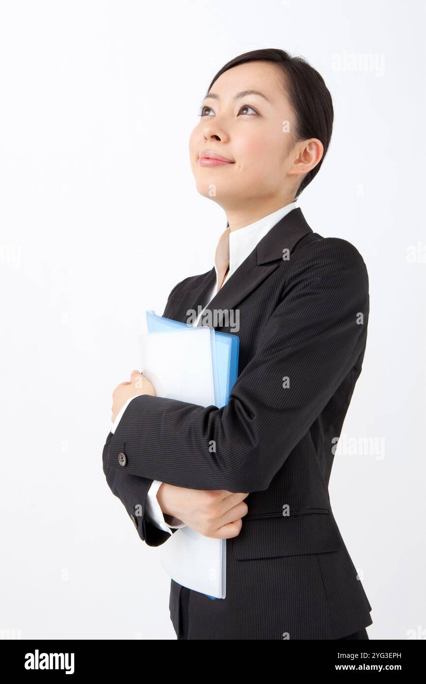 Office worker holding file Stock Photo - Alamy