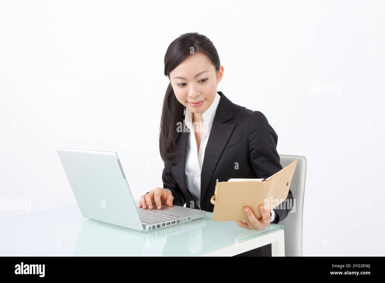 Office worker checking schedule Stock Photo - Alamy