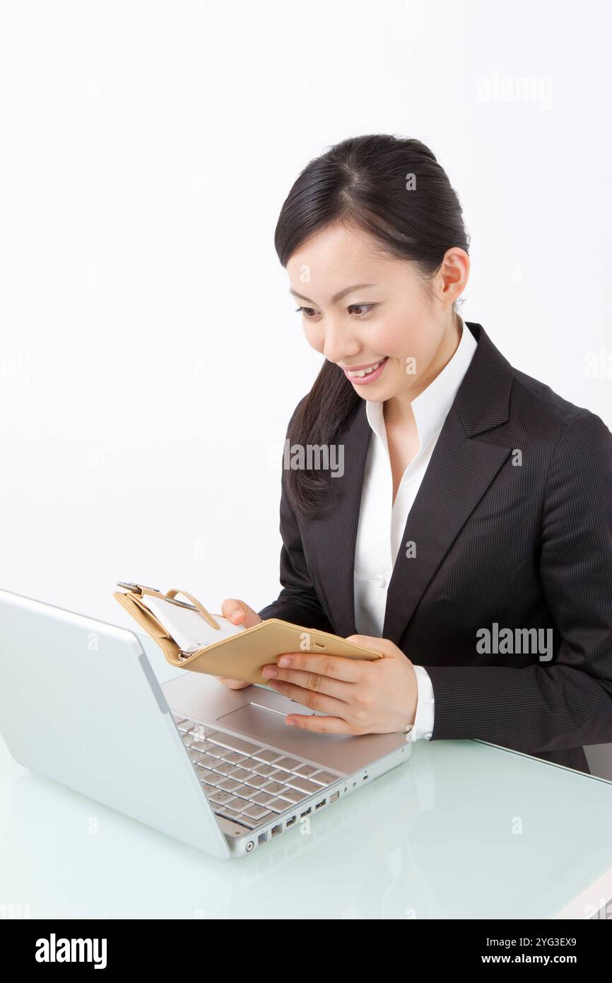 Office worker checking schedule Stock Photo - Alamy