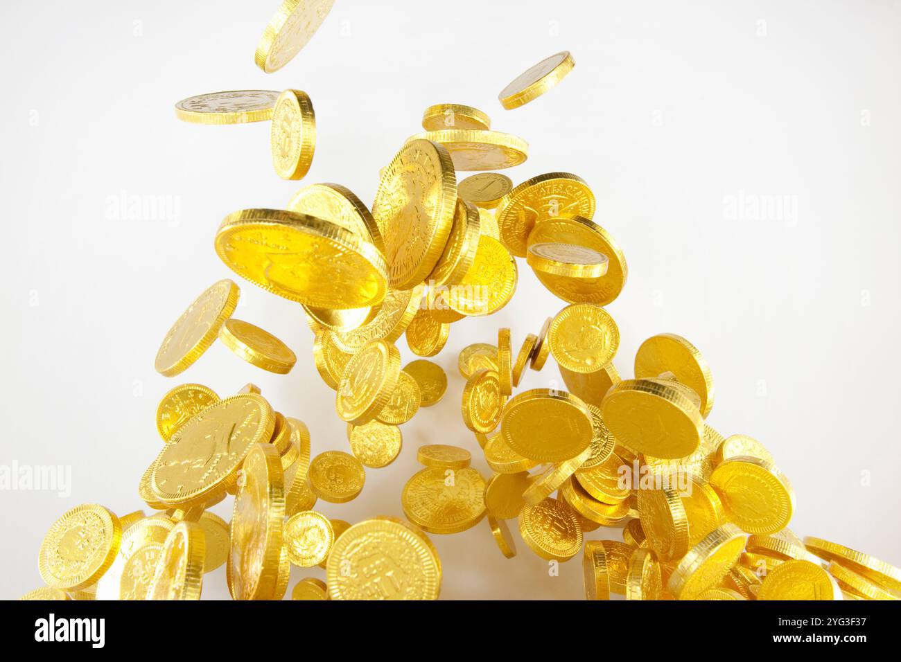 Flying gold coins Stock Photo - Alamy