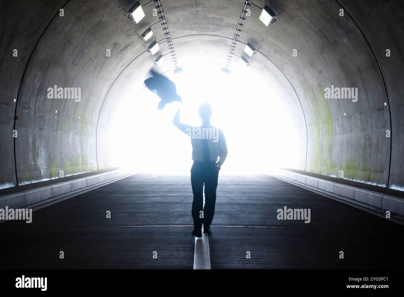 Business people walking through tunnel hi-res stock photography and ...