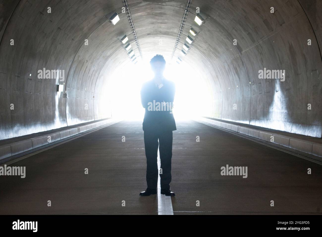 Business people walking through tunnel hi-res stock photography and ...