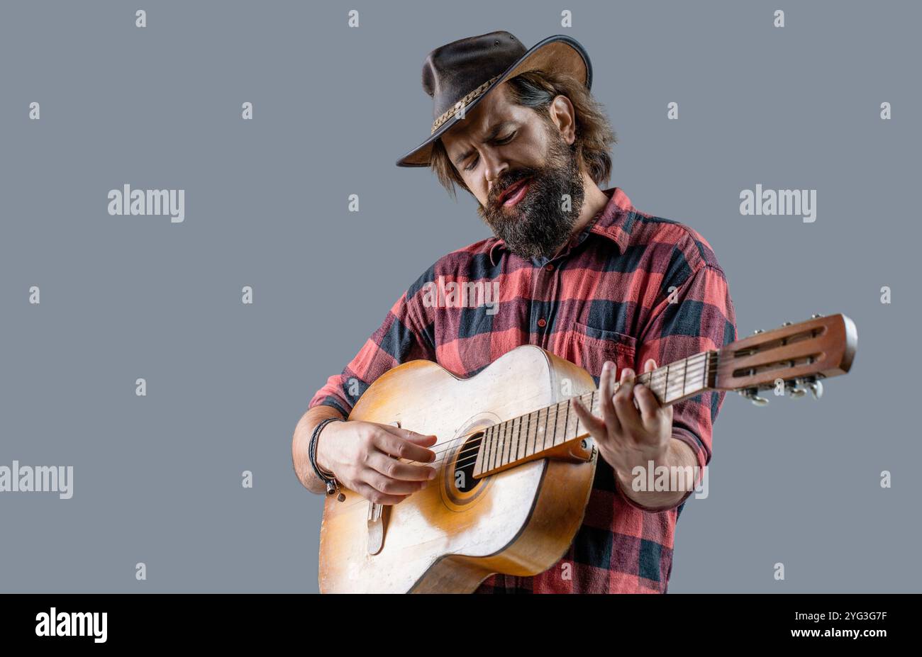 Cowboy playing guitar, singer, sing. Man cowboys playing acoustic ...