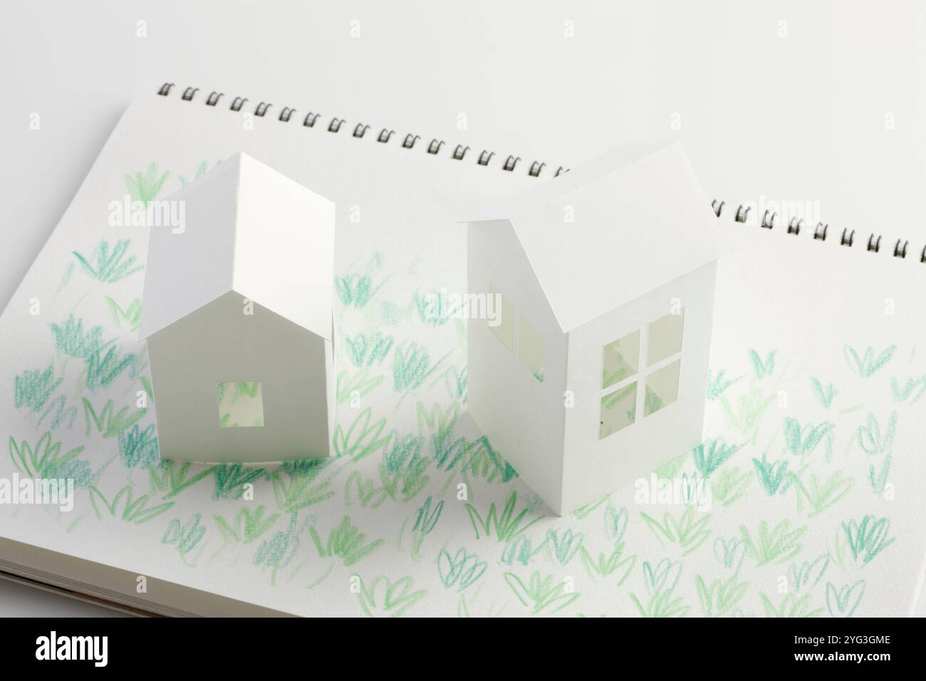 Paper craft house and illustration lawn Stock Photo - Alamy