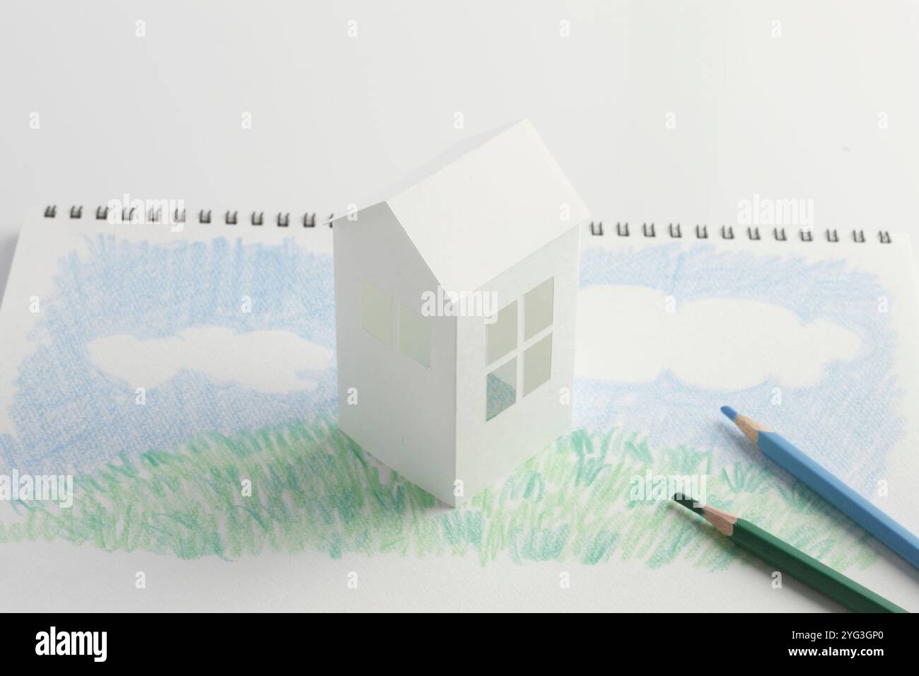 Paper craft house and illustration lawn Stock Photo - Alamy