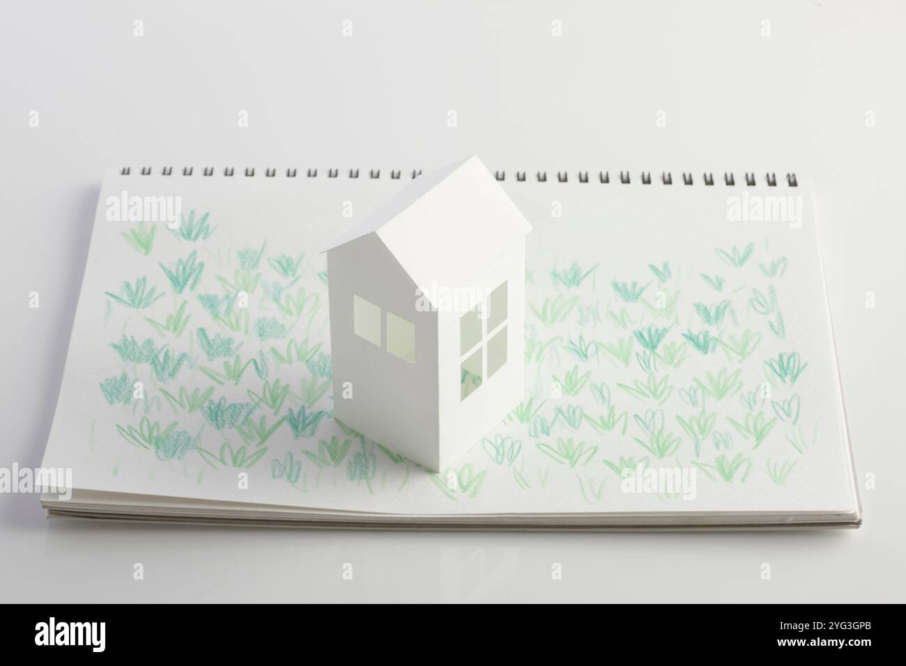 Paper craft house and illustration lawn Stock Photo - Alamy