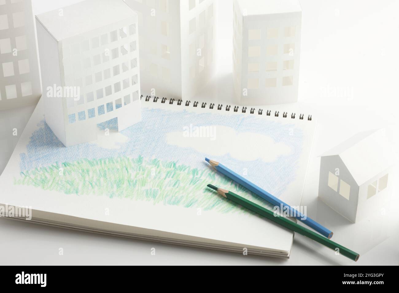 Paper craft house and illustration lawn with building Stock Photo - Alamy