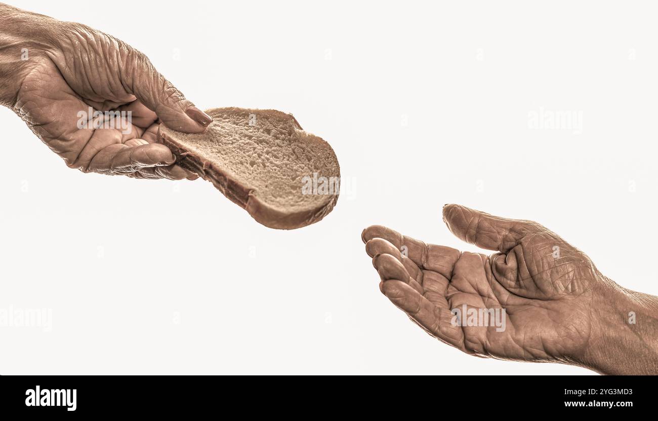 Helping the homeless. Woman giving poor homeless person pieces of bread ...